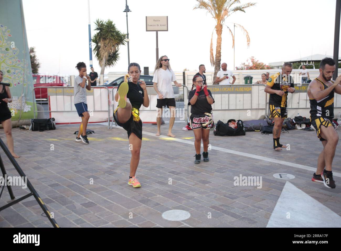 The images depict an animated children's kickboxing class in Italy at a ...