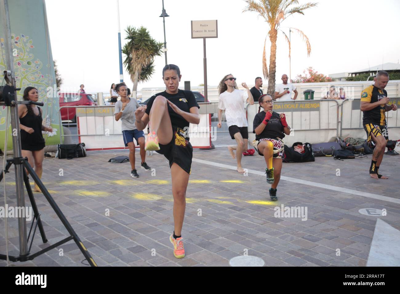 The images depict an animated children's kickboxing class in Italy at a ...