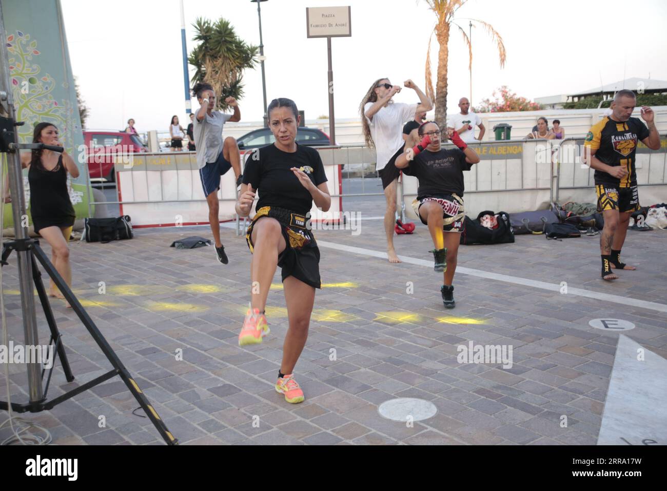The images depict an animated children's kickboxing class in Italy at a ...
