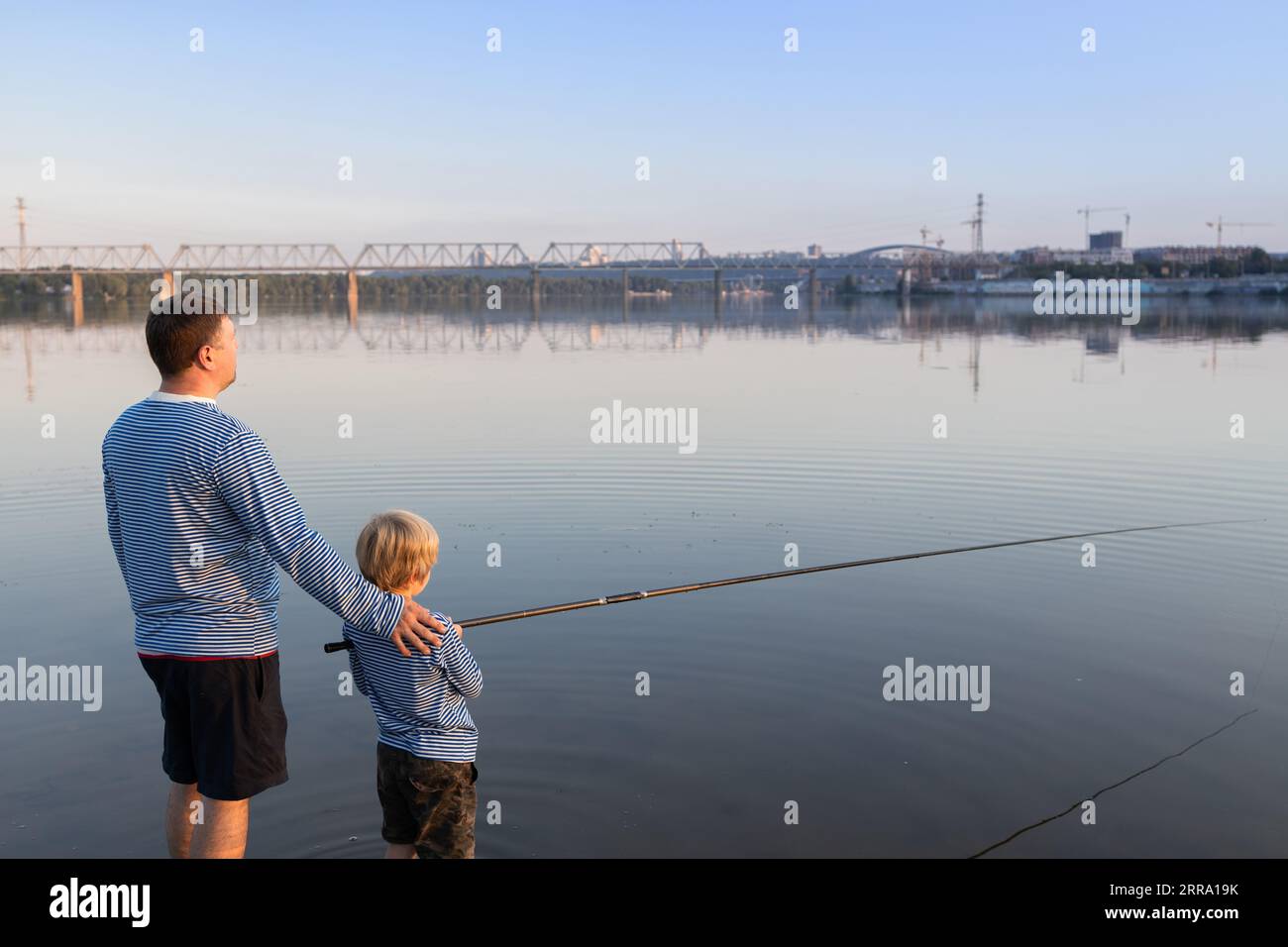 Father and son go fishing together. father's day concept. Family fun ...