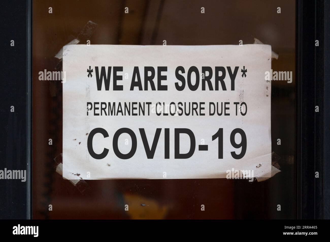 Paper scotched inside the window of a restaurant with written on it ...