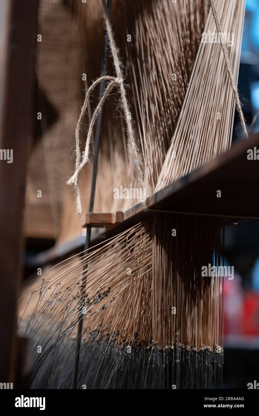 Weaving threads hi-res stock photography and images - Alamy