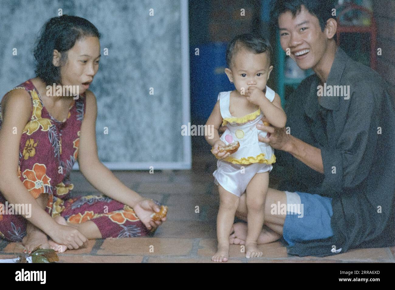 Vietnamese couple proudly showing his little baby girl with a happy ...
