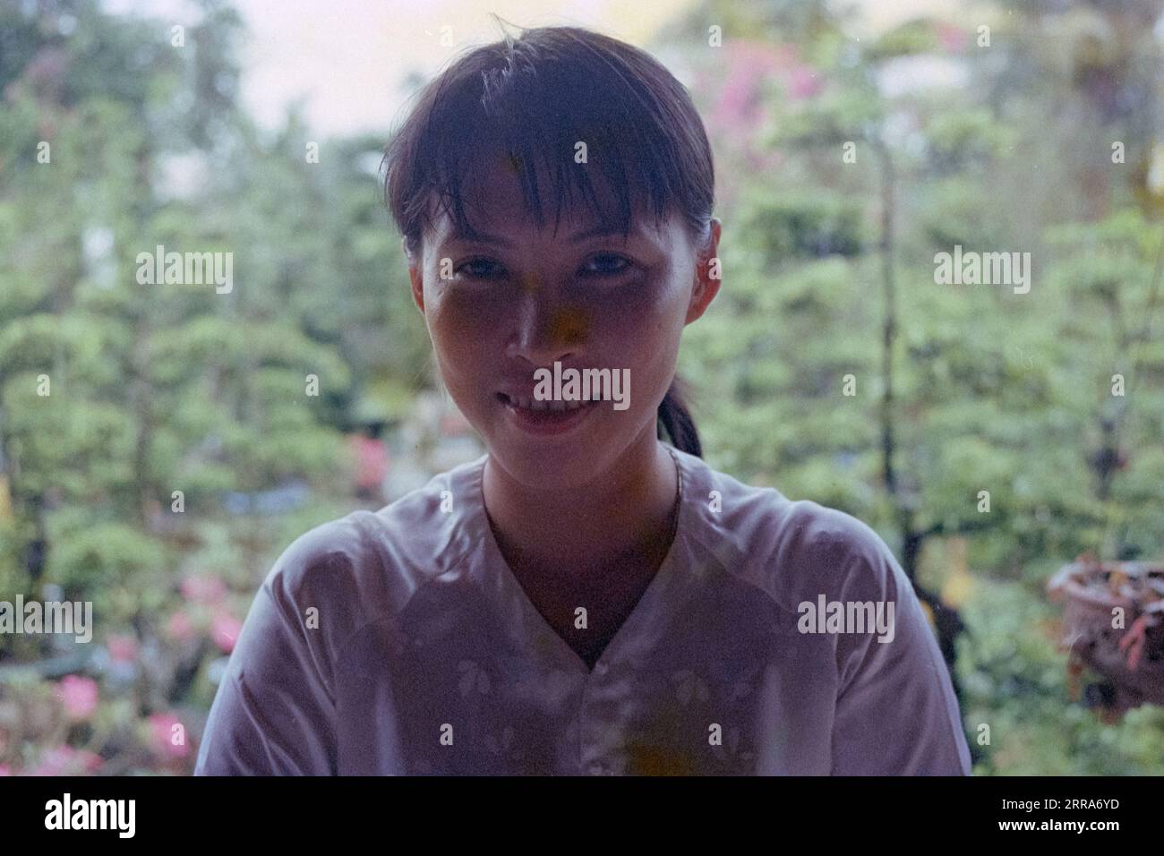 Portrait of a young Vietnamese female tour guide Stock Photo - Alamy