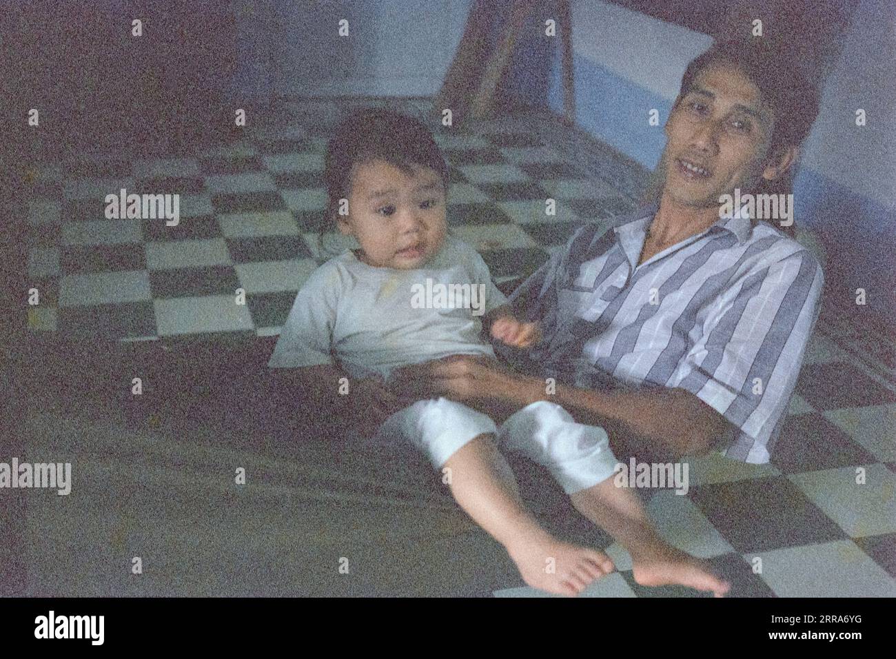 Vietnamese father proudly showing his little baby girl with a happy ...