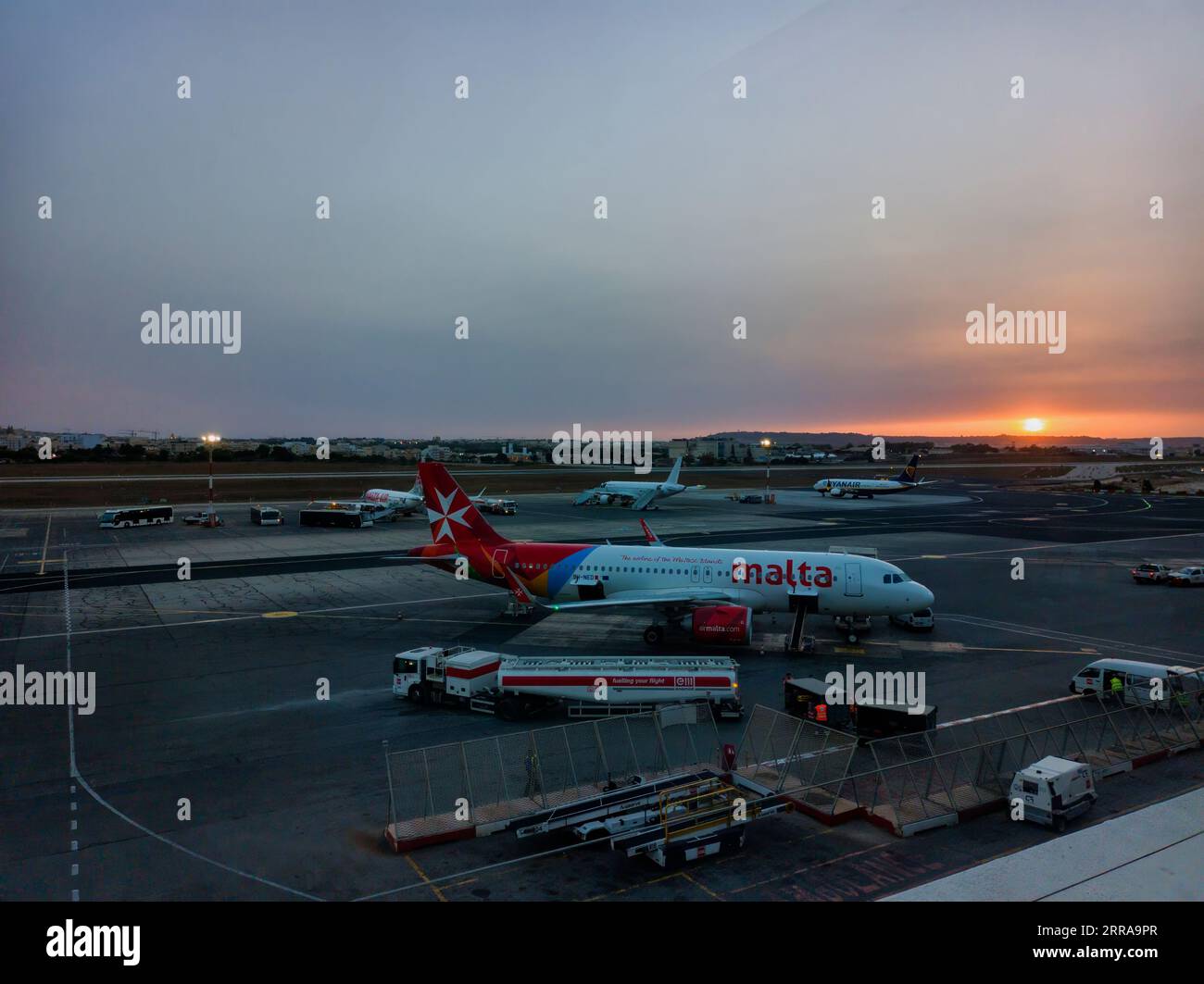 Sunset over Luqa International Airport in Malta Stock Photo - Alamy