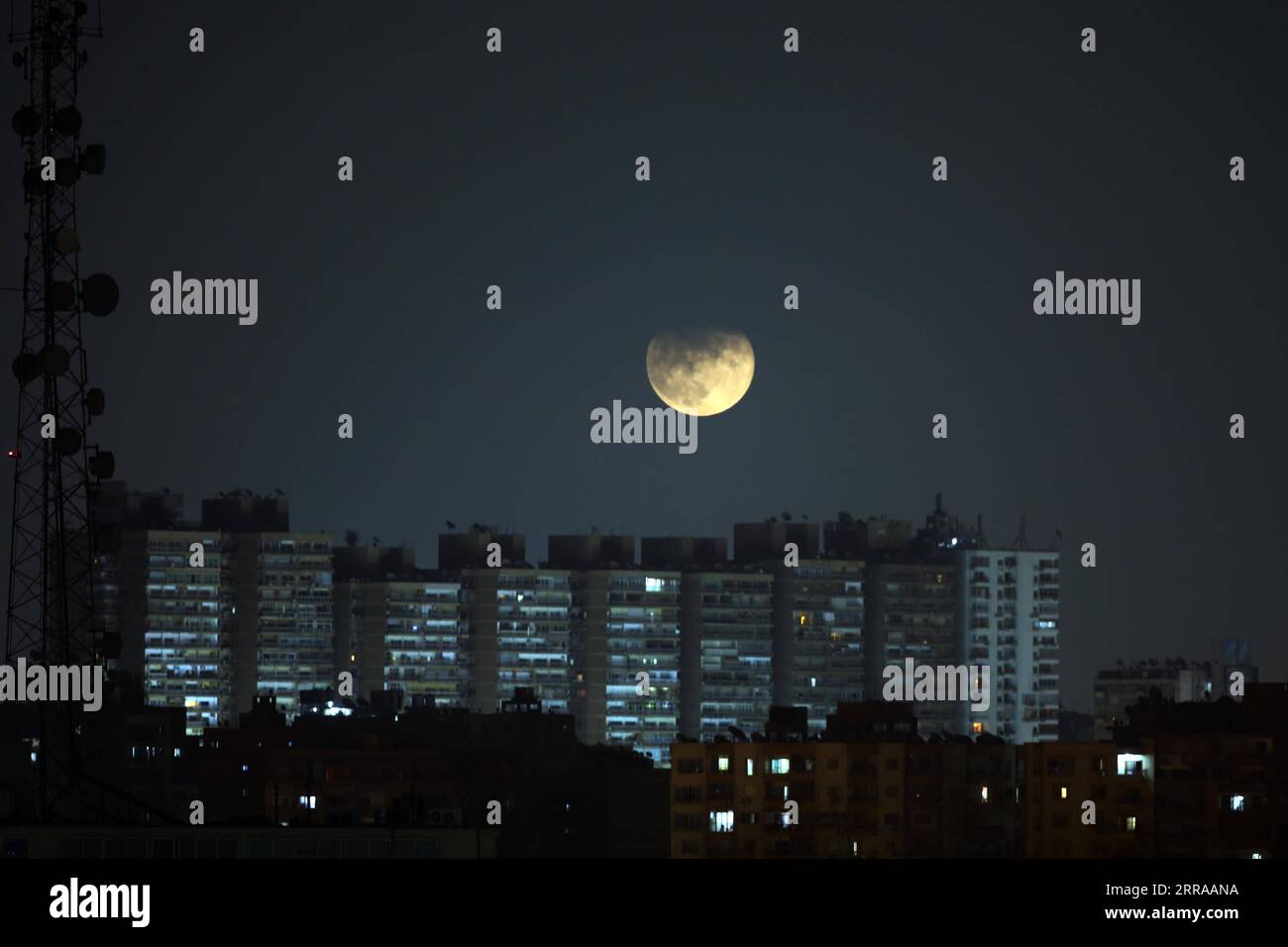 210724 -- CAIRO, July 24, 2021 -- A full moon is seen over buildings in ...