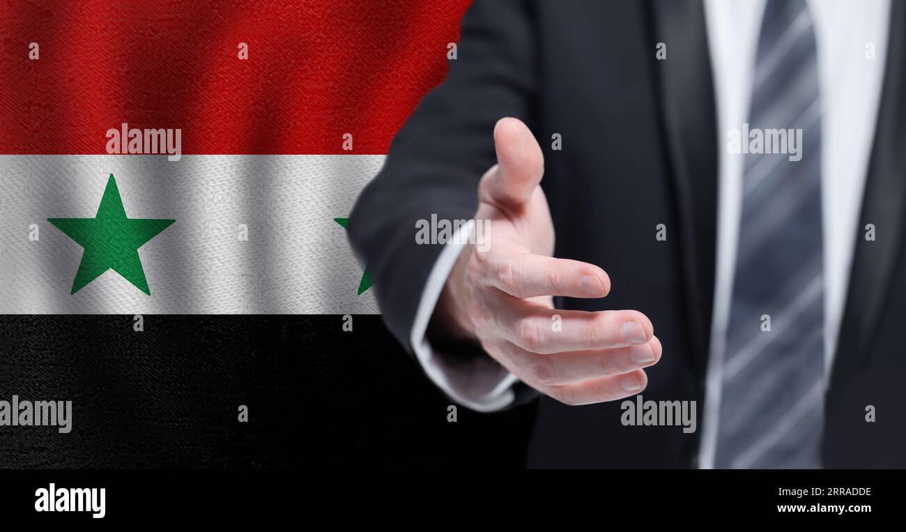 Syrian business, politics, cooperation and travel concept. Hand on flag ...