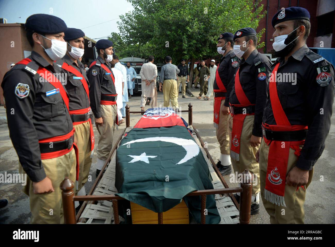 210730 -- PESHAWAR, July 30, 2021 -- Policemen attend the funeral of ...