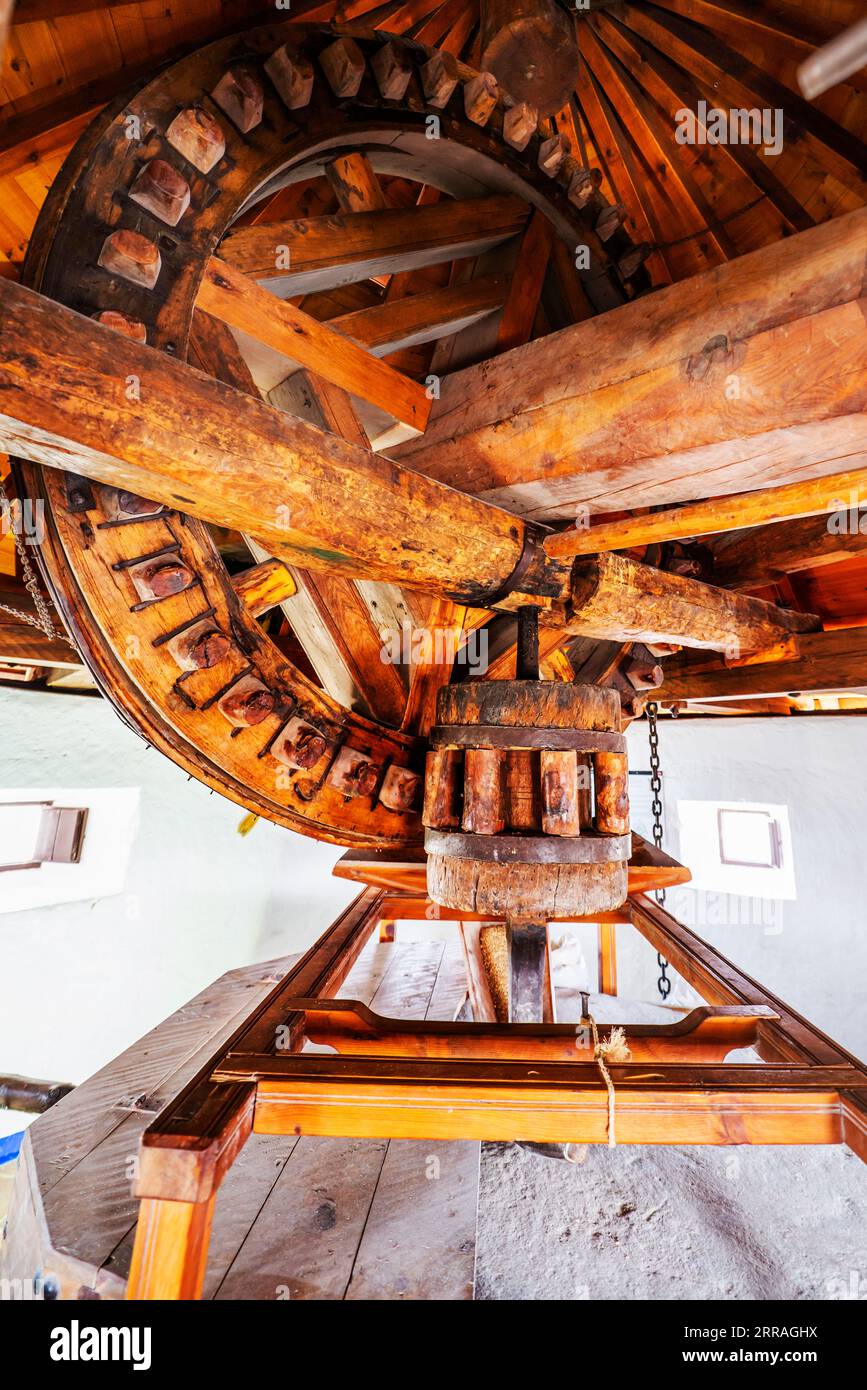 Rudimentary wood and stone machinery grinding from an ancient windmill ...