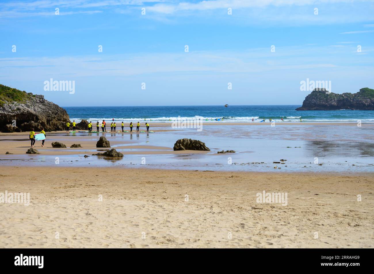 Young surfers train with boards on Playa de Palombina Las Camaras in ...