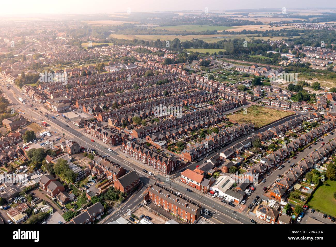 An aerial view above the rooftops of run down back to back terraced ...