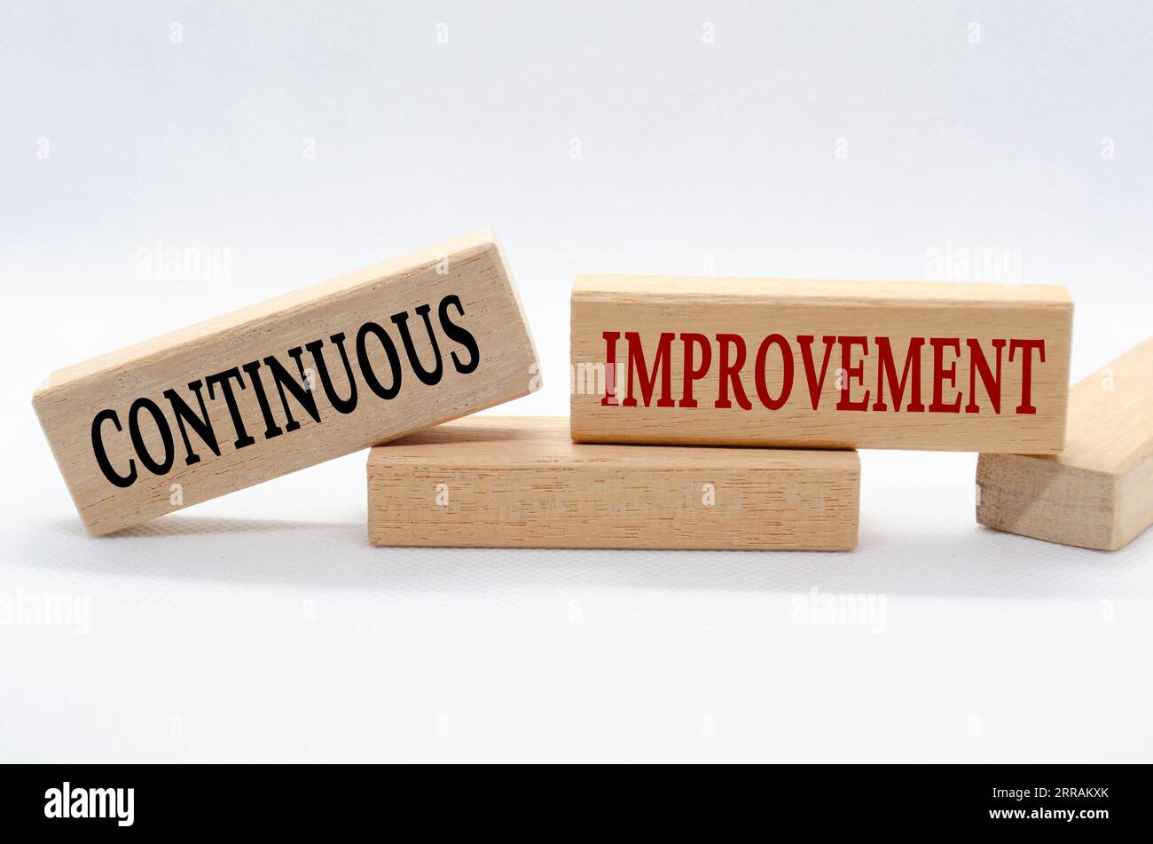 Continuous improvement text on wooden blocks. Business culture and ...