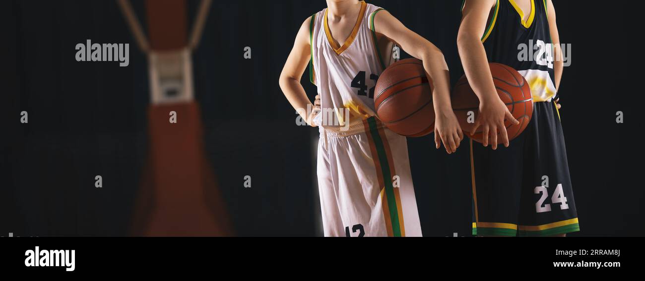 Two little boys holding basketball balls under their arms. Young ...