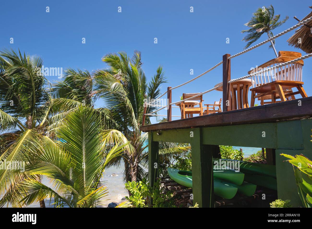 Wooden terrace with chair and table on ocean beach background Stock ...
