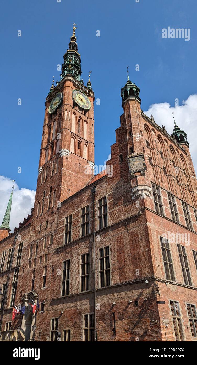 The majestic brick building of the Main Town Hall of Gdansk with a ...