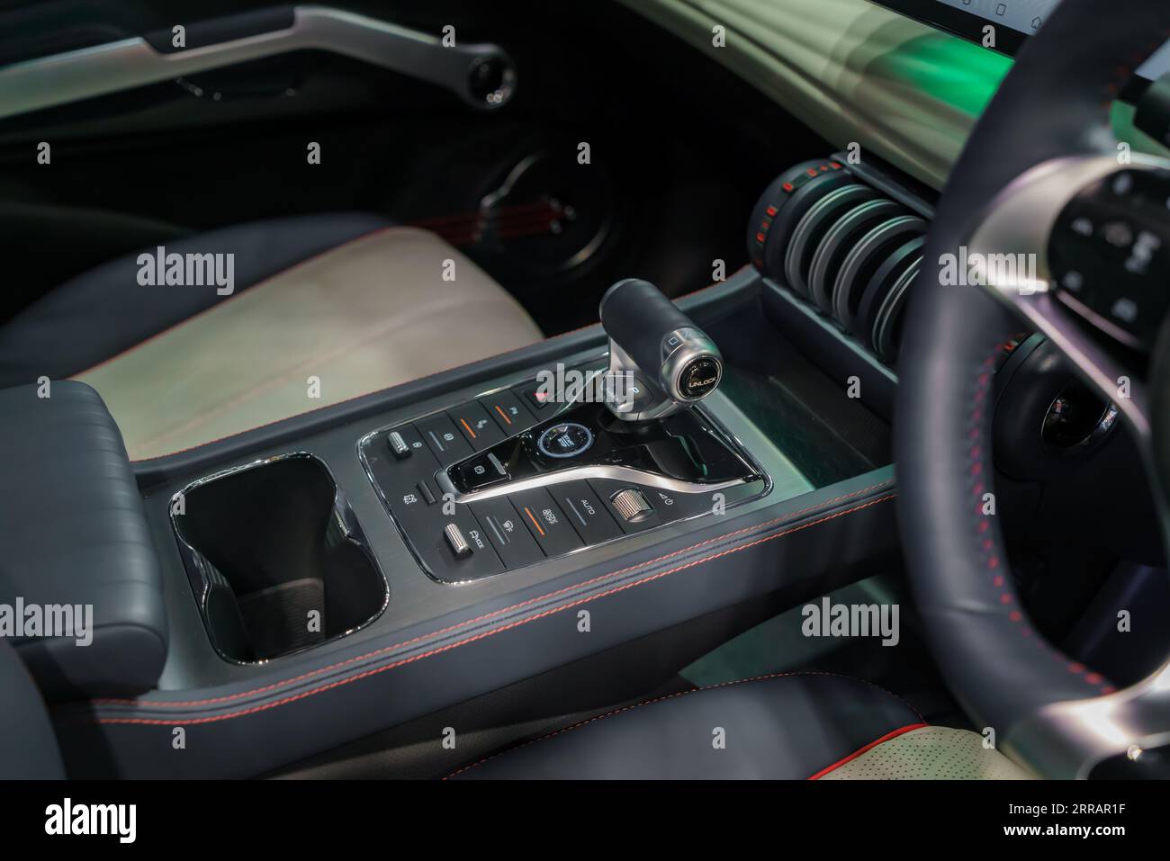 EV gear shift, a blend of form and function. Illuminated buttons beckon ...