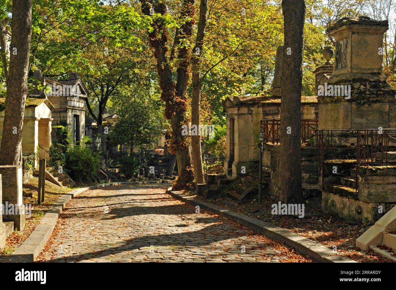 A cobblestone road leads past old tombs and grave sites in Paris ...