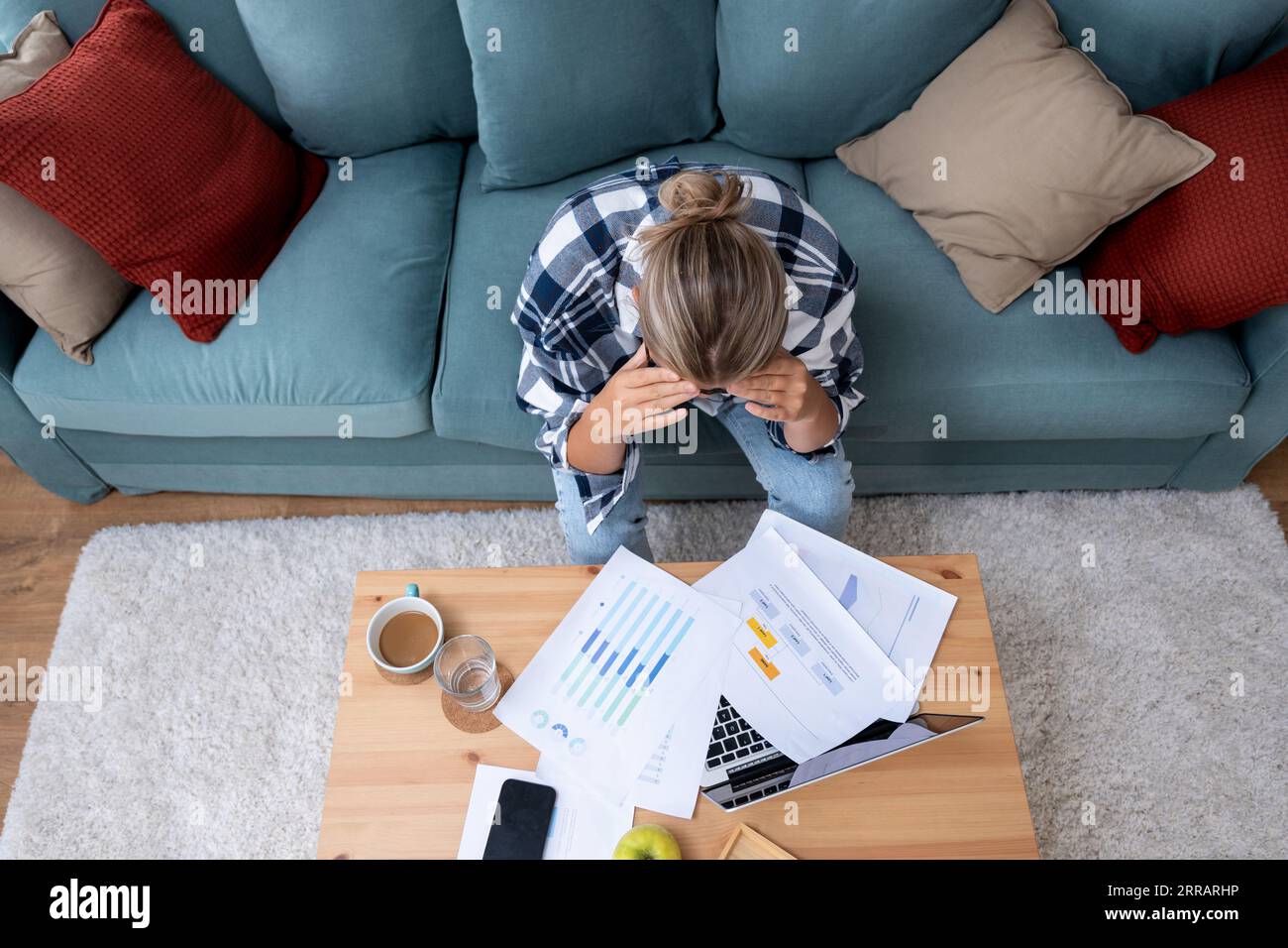 Confused woman calculator paperwork hi-res stock photography and images ...