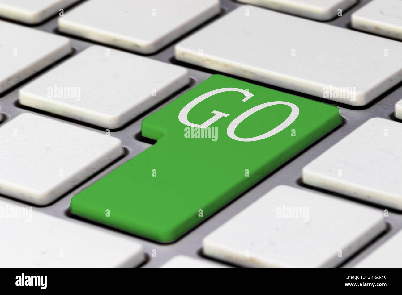 A Green key on a computer keyboard reading GO in capital letters Stock ...