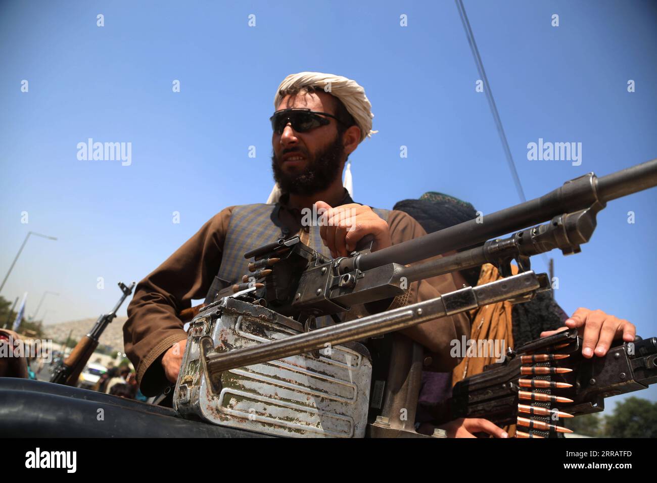 210816 -- KABUL, Aug. 16, 2021 -- Afghan Taliban fighters stand on a ...