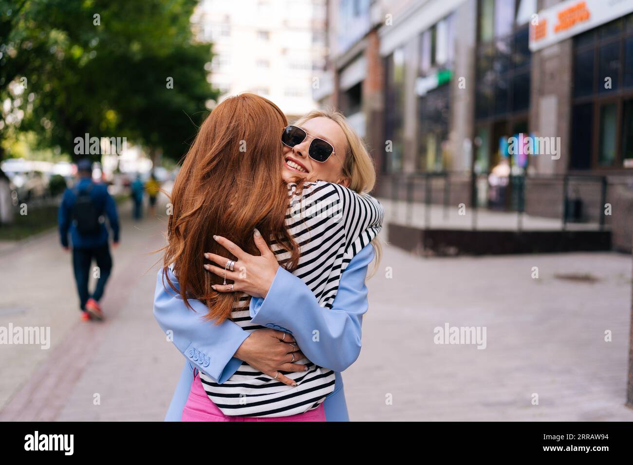 Back view of unrecognizable joyful young pretty woman running toward ...