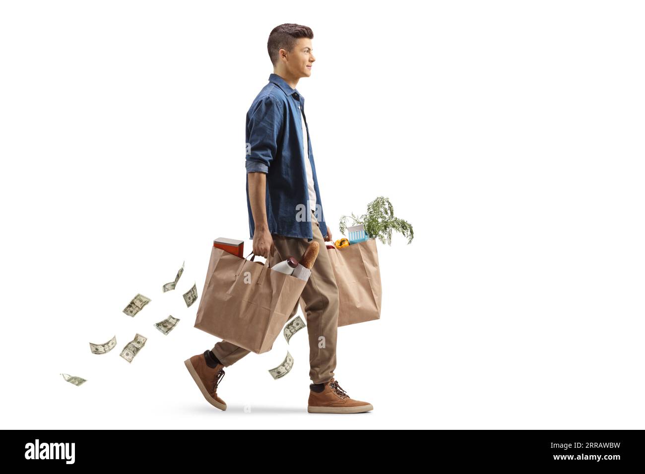 Full length profile shot of a guy carrying groceries and money falling ...