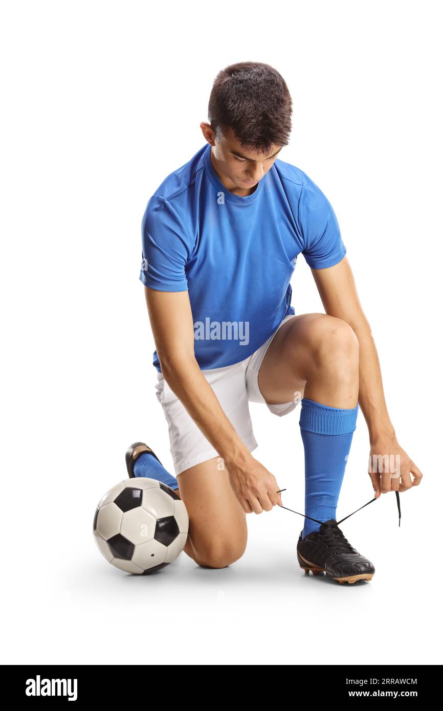 Soccer player tying shoe Cut Out Stock Images & Pictures - Alamy