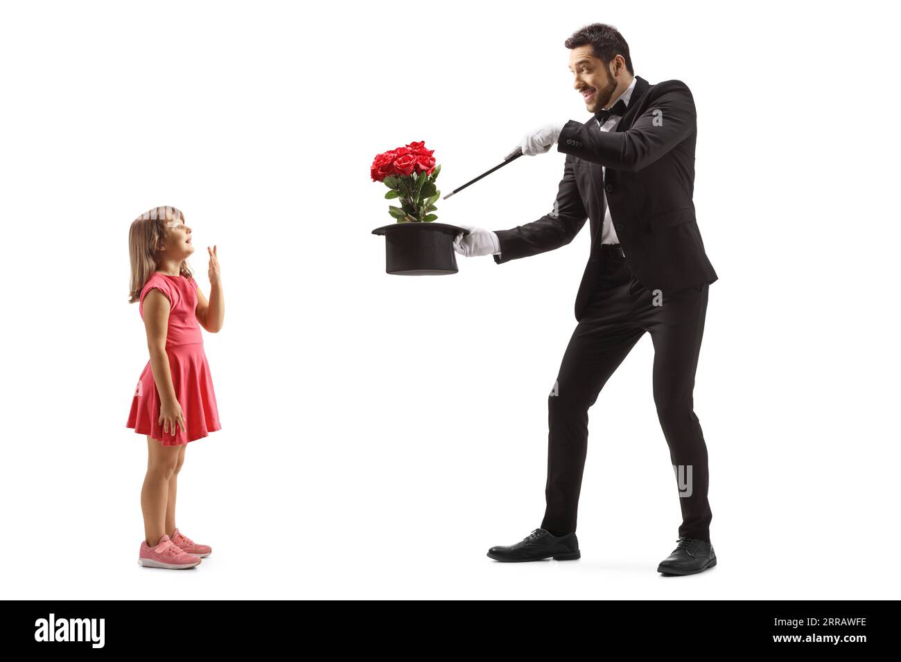 Full length profile shot of a girl watching a magician performing a ...