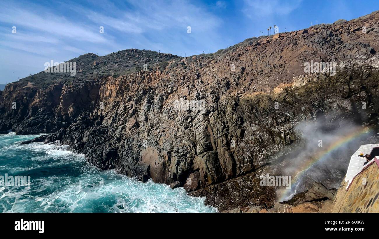 The Bufadora, a marine gesiser with a rainbow in the Mexican city of ...