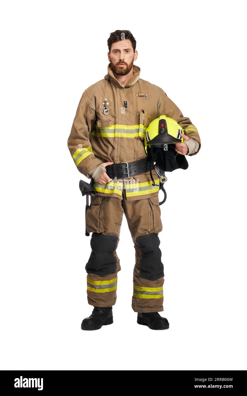 Tired bearded firefighter in uniform, holding protective helmet. Front ...