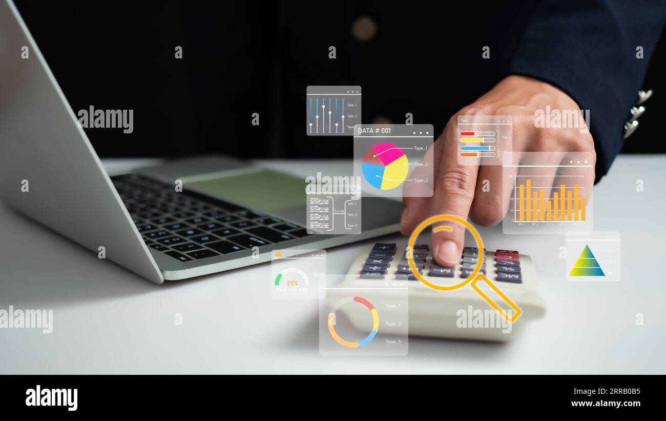 Business people use computers and calculator to analyze business and ...