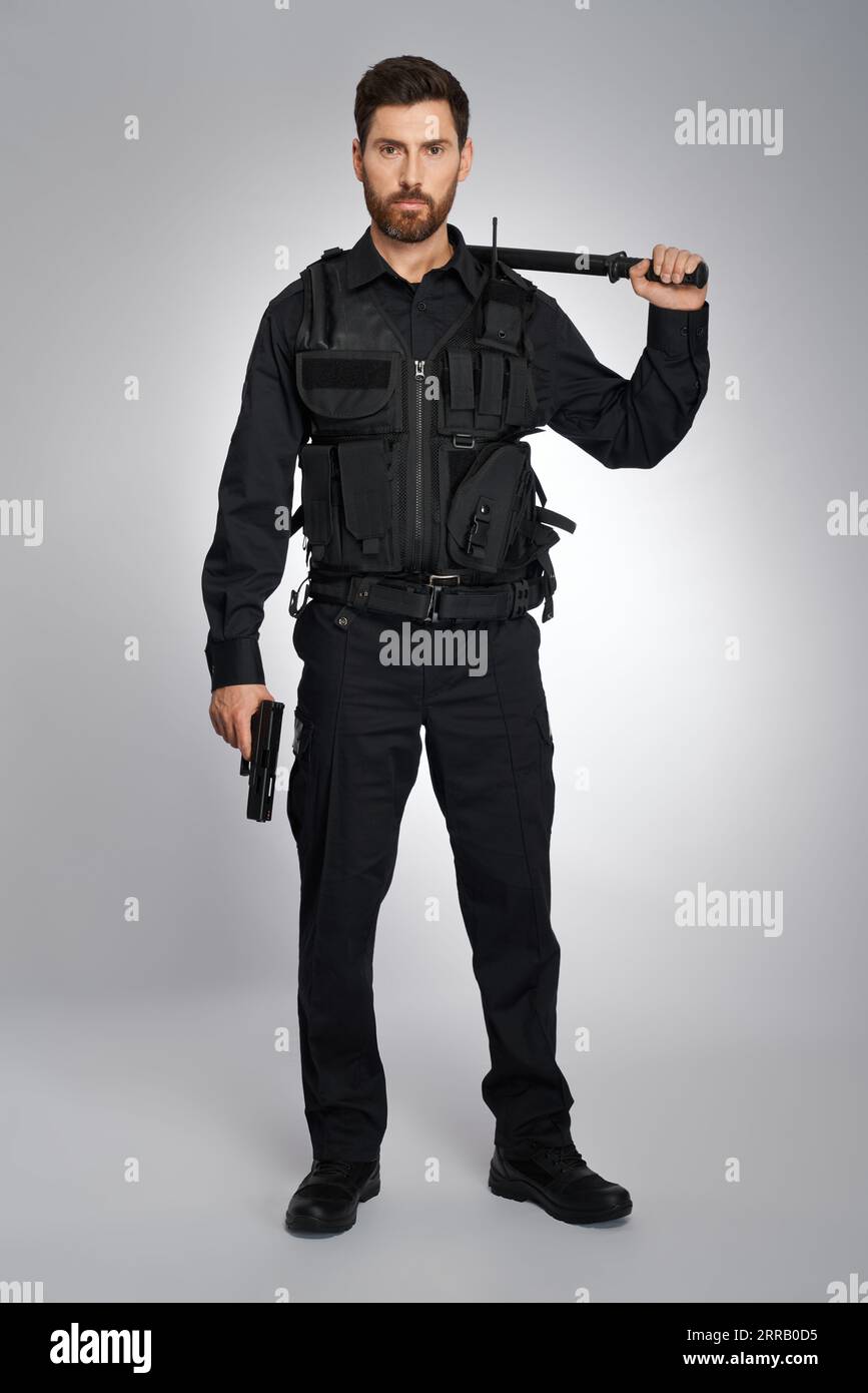 Standing police officer carrying on duty uniform hi-res stock ...