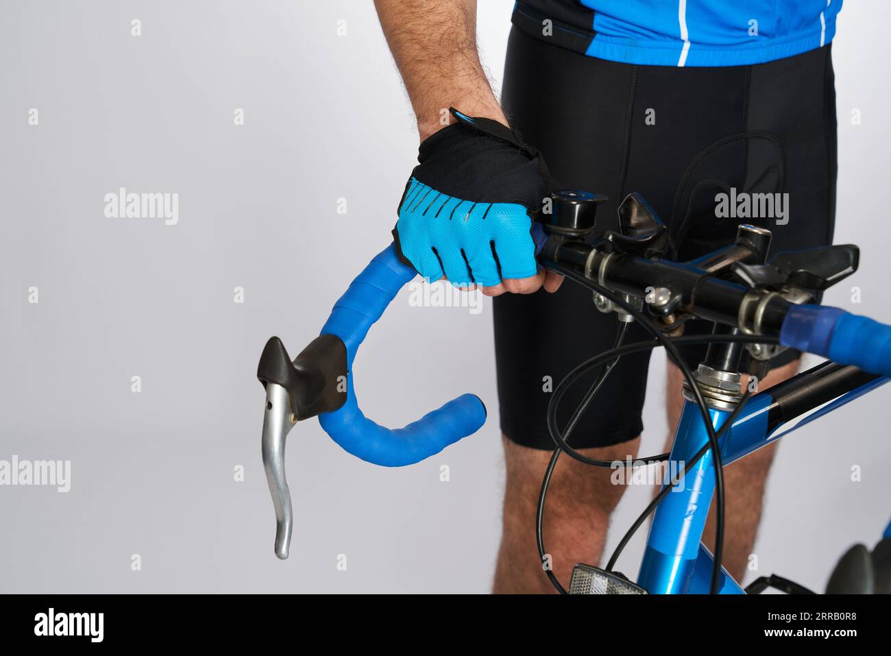 Detail of handlebar of modern blue racing bicycle holding by male ...