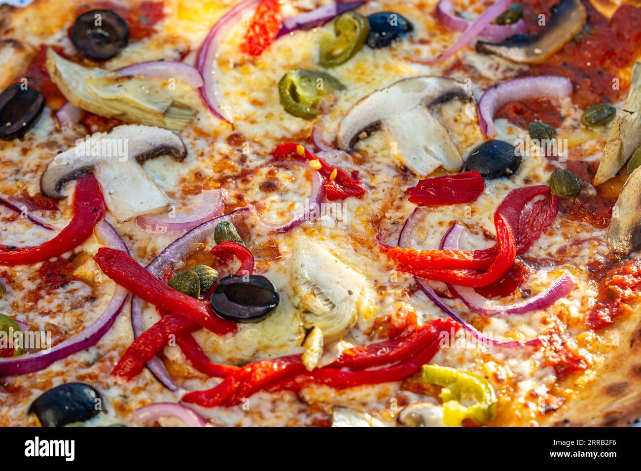 A cooked vegetarian pizza, fresh from the oven Stock Photo - Alamy