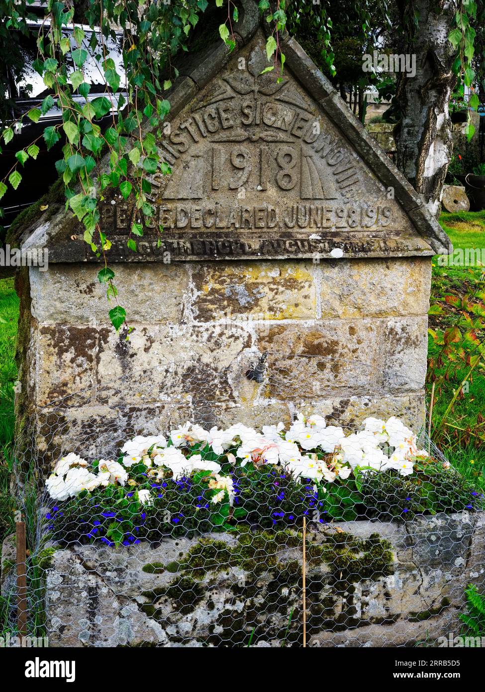 The Victory Memorial with water tap and trough at Lofthouse Nidderdale ...