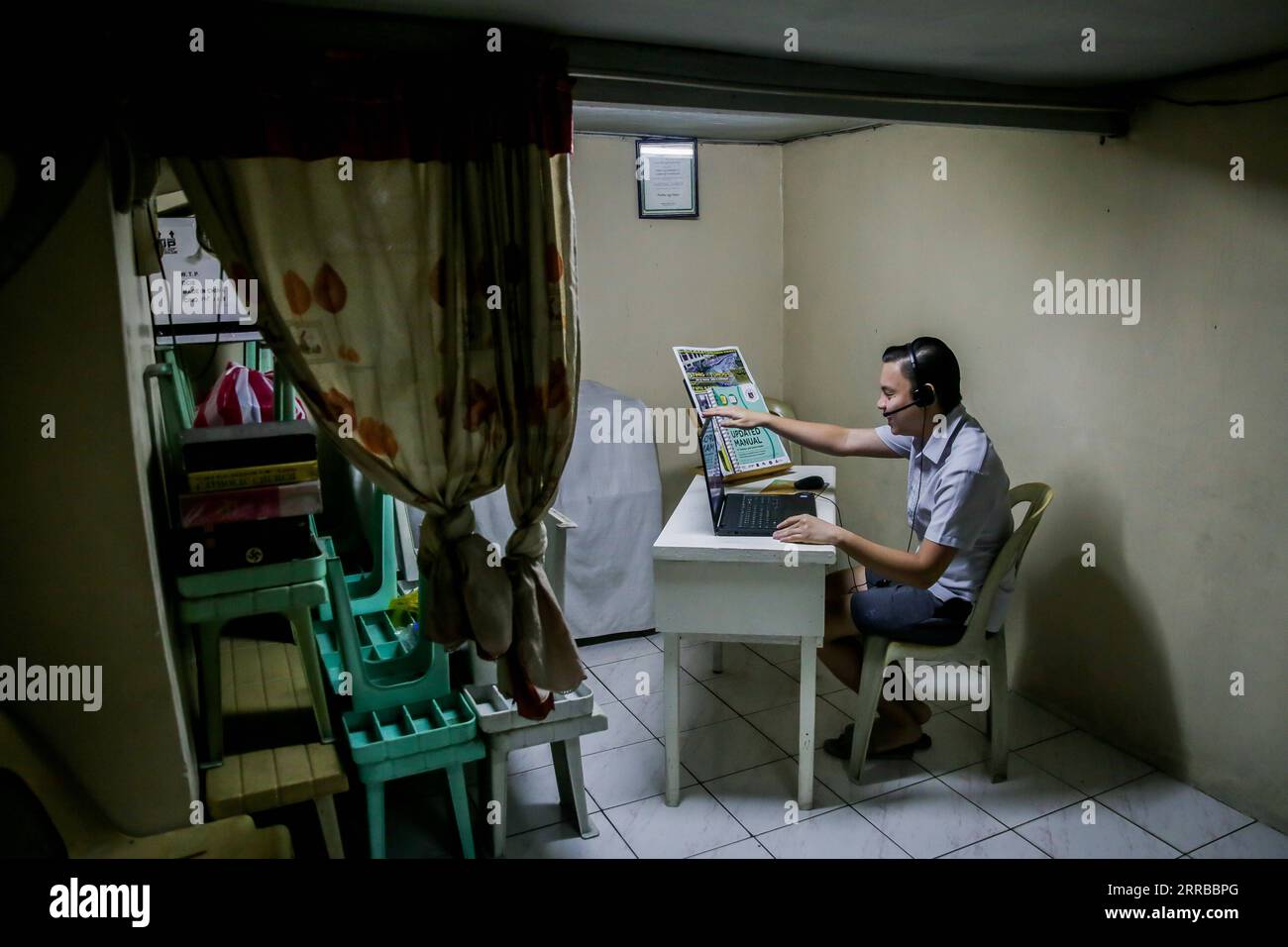 210913 -- MANILA, Sept. 13, 2021 -- Teacher Calvin Errol Alcantara is seen in front of his ...