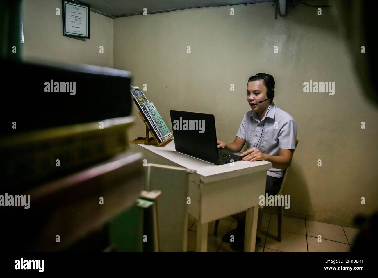 210913 -- MANILA, Sept. 13, 2021 -- Teacher Calvin Errol Alcantara is seen in front of his ...
