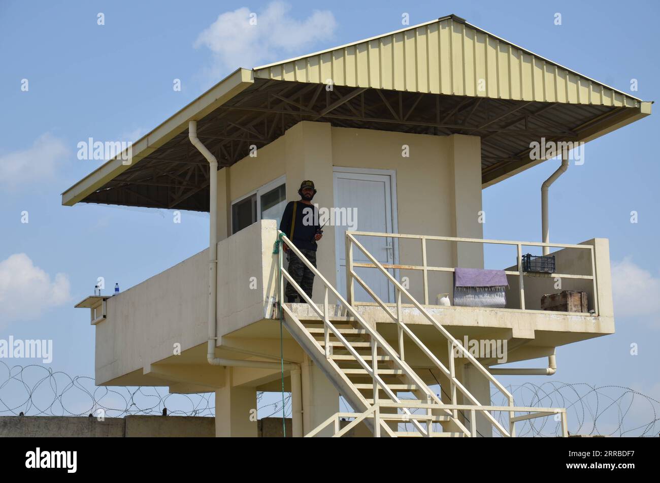 210915 -- KHOST, Sept. 15, 2021 -- A member of Taliban stands guard on ...