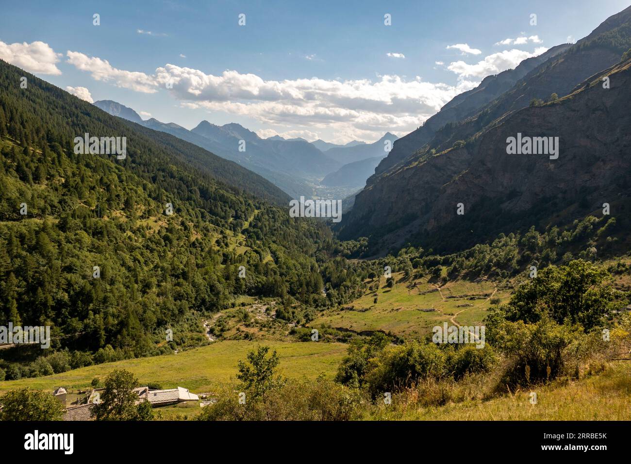 A scenic landscape featuring expansive green hills and mountain peaks ...