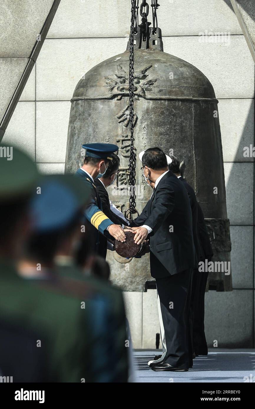 210918 -- SHENYANG, Sept. 18, 2021 -- People attend a bell-tolling ...