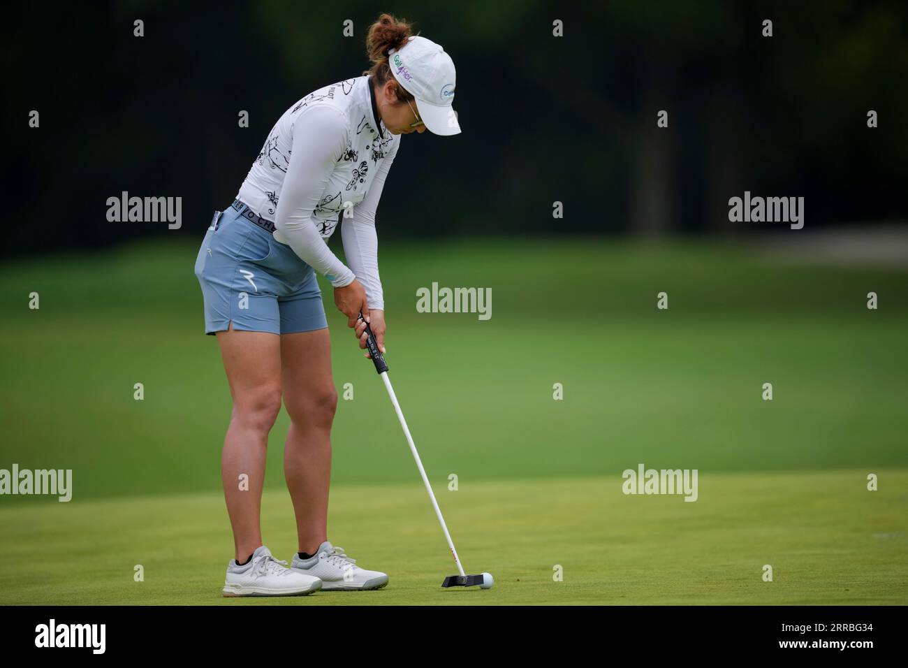 Marina Alex putts on the fifth green during the first round of the LPGA ...