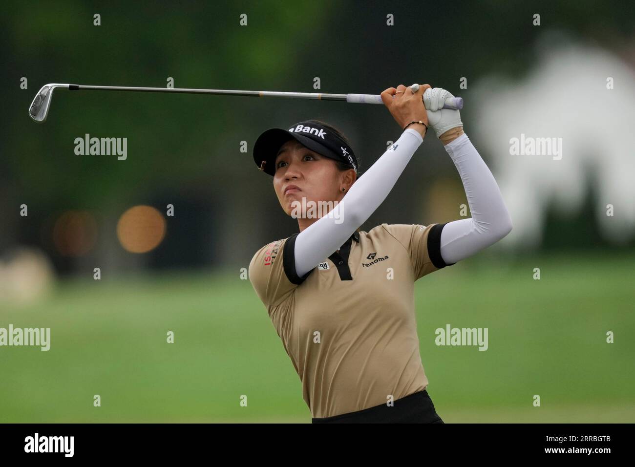 Lydia Ko, of New Zealand, plays a shot from the rough on the first hole ...