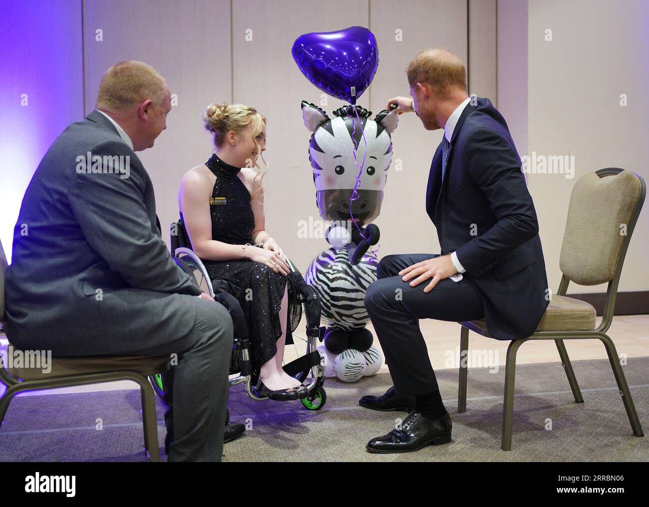 The Duke of Sussex speaks to Hayley and her father Stephen Cassin ...