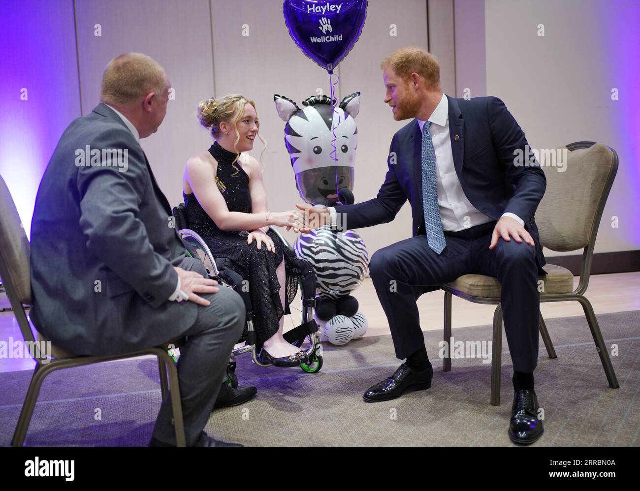 The Duke of Sussex speaks to Hayley and her father Stephen Cassin ...