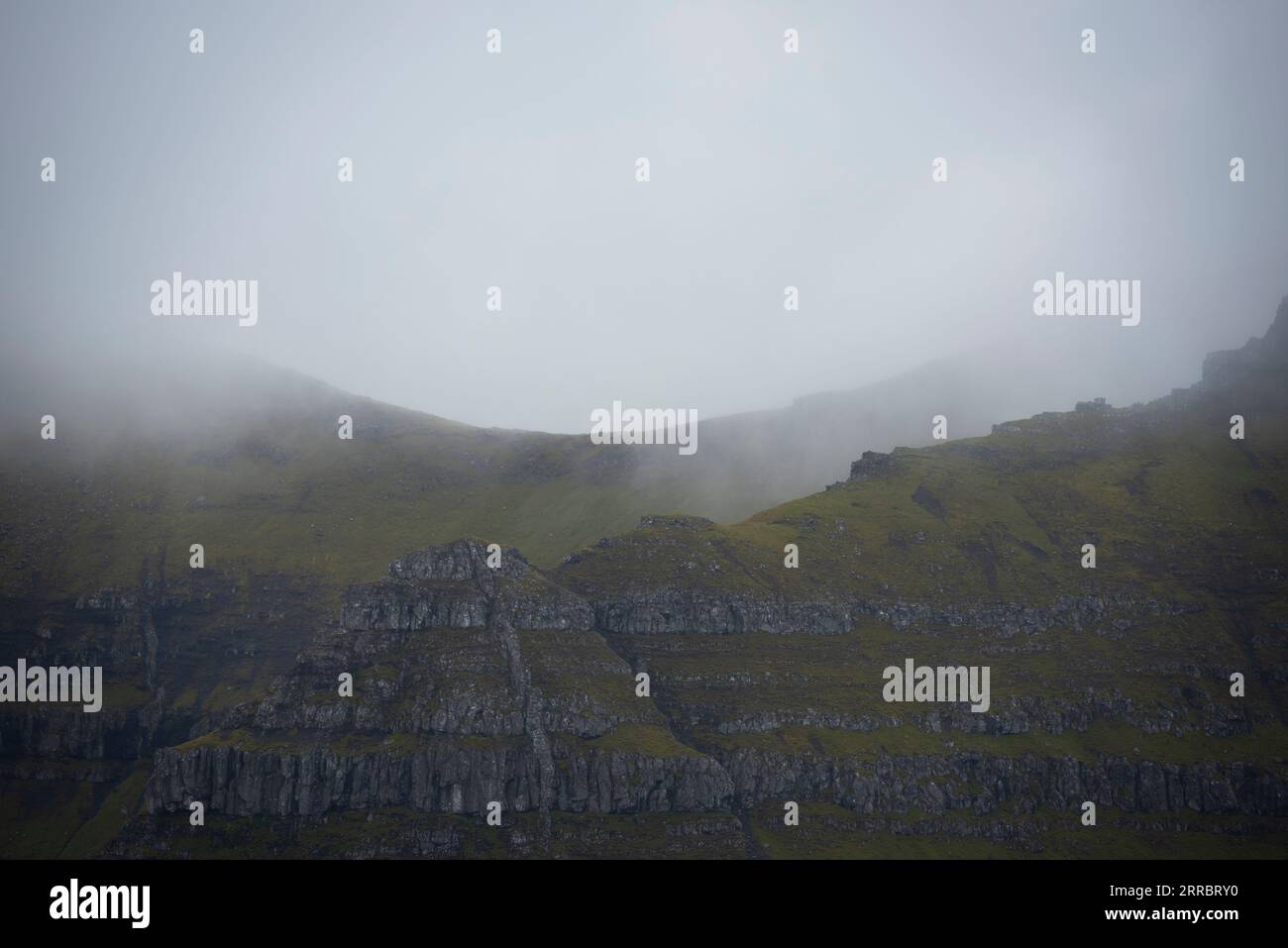 Knife edge ridge in the mountains atop Eysturoy island in the Faroe ...