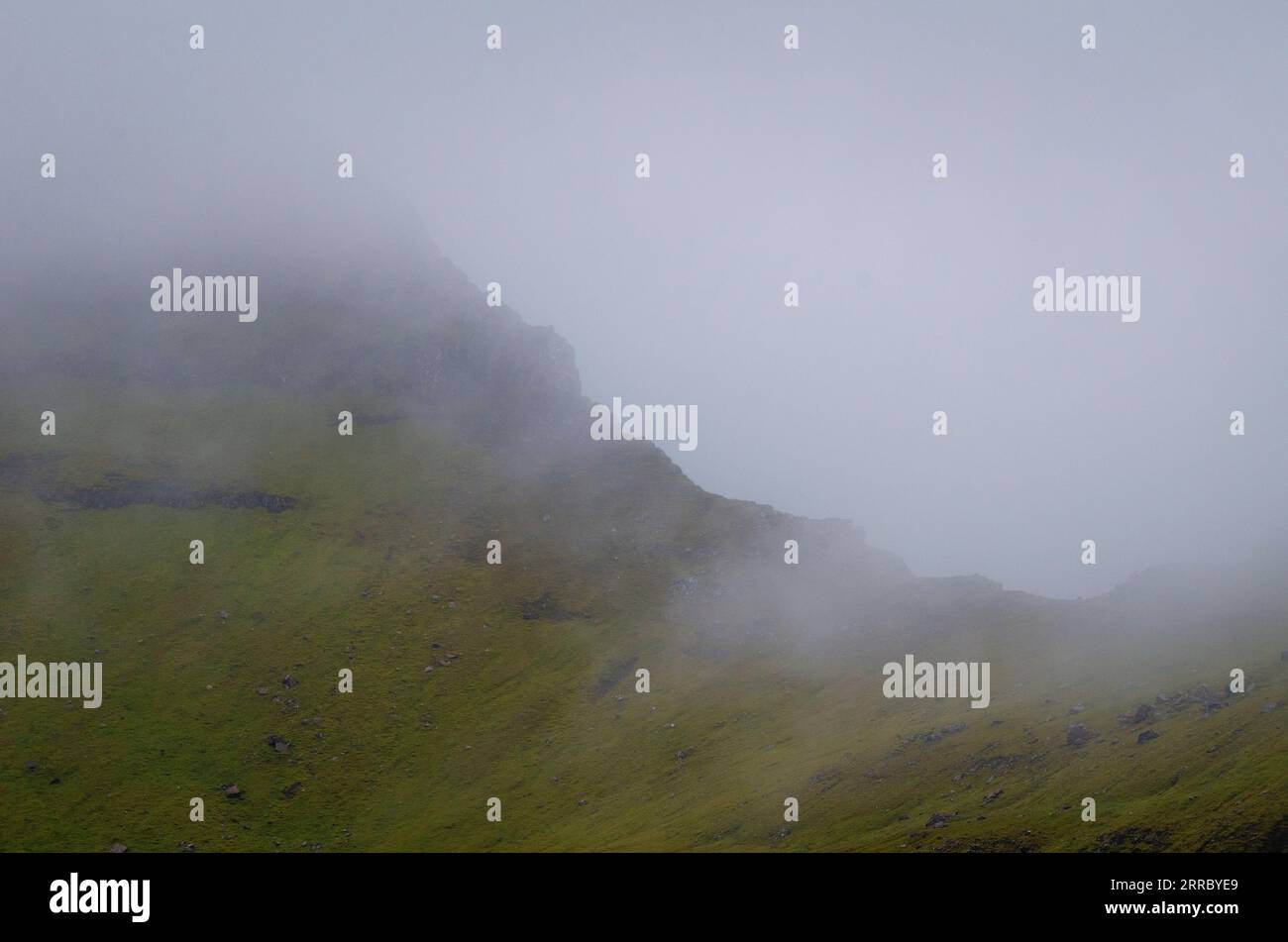 Knife edge ridge in the mountains atop Eysturoy island in the Faroe ...