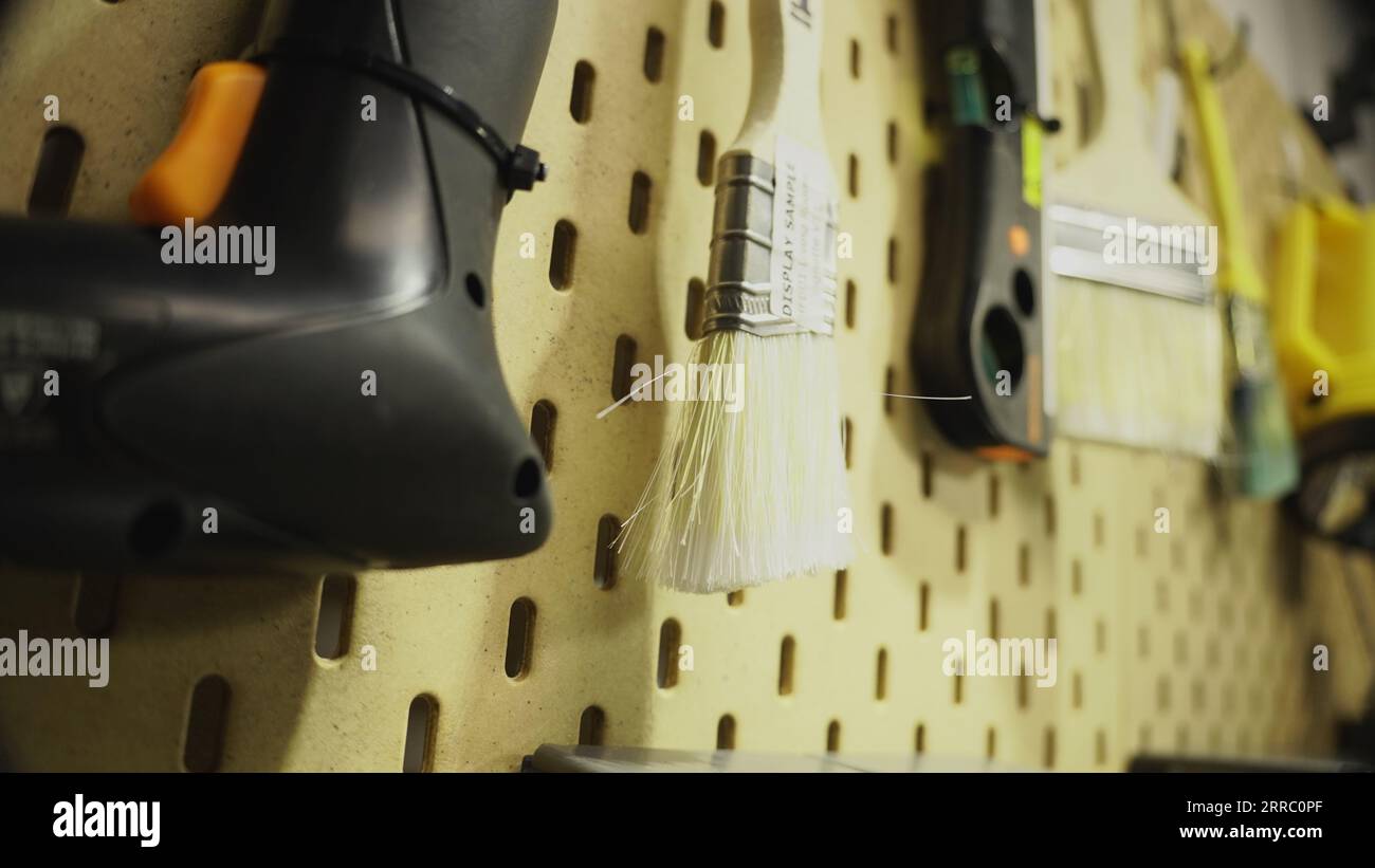 A close-up of an organized wall of tools in a shop Stock Photo - Alamy