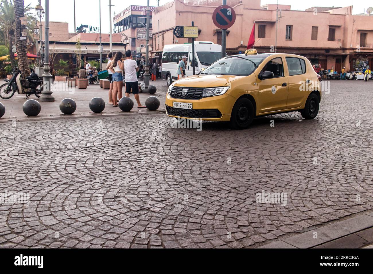 Marrakech, Morocco - August 27, 2023 Taxi driving through the streets ...