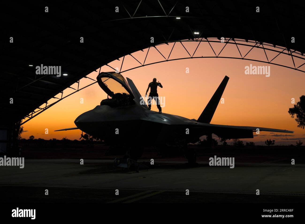 U.S. Air Force F-22 Raptor crew chief conducts a post-flight inspection ...